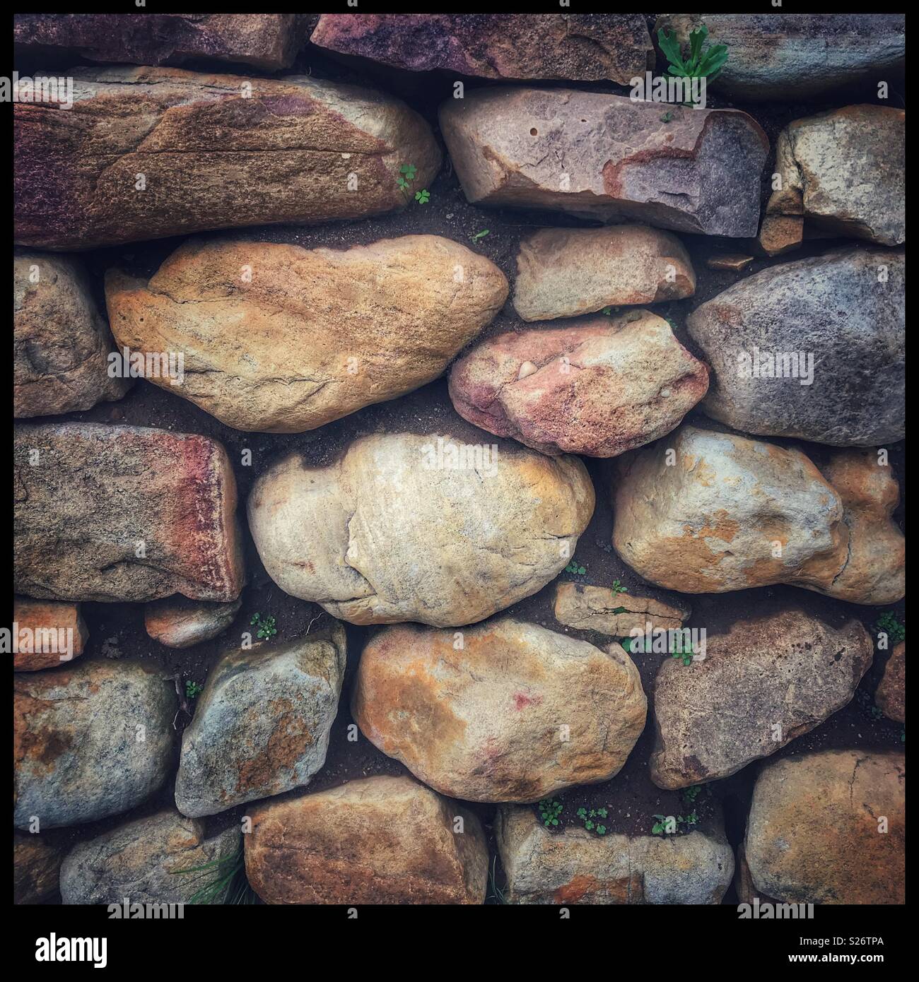 Wall built by stacking stones Stock Photo - Alamy