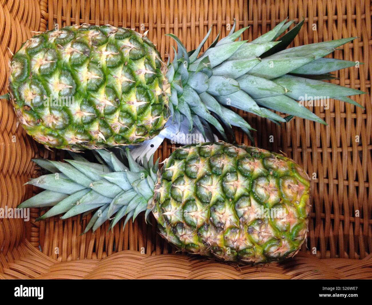 Pineapple in a basket hi-res stock photography and images - Alamy