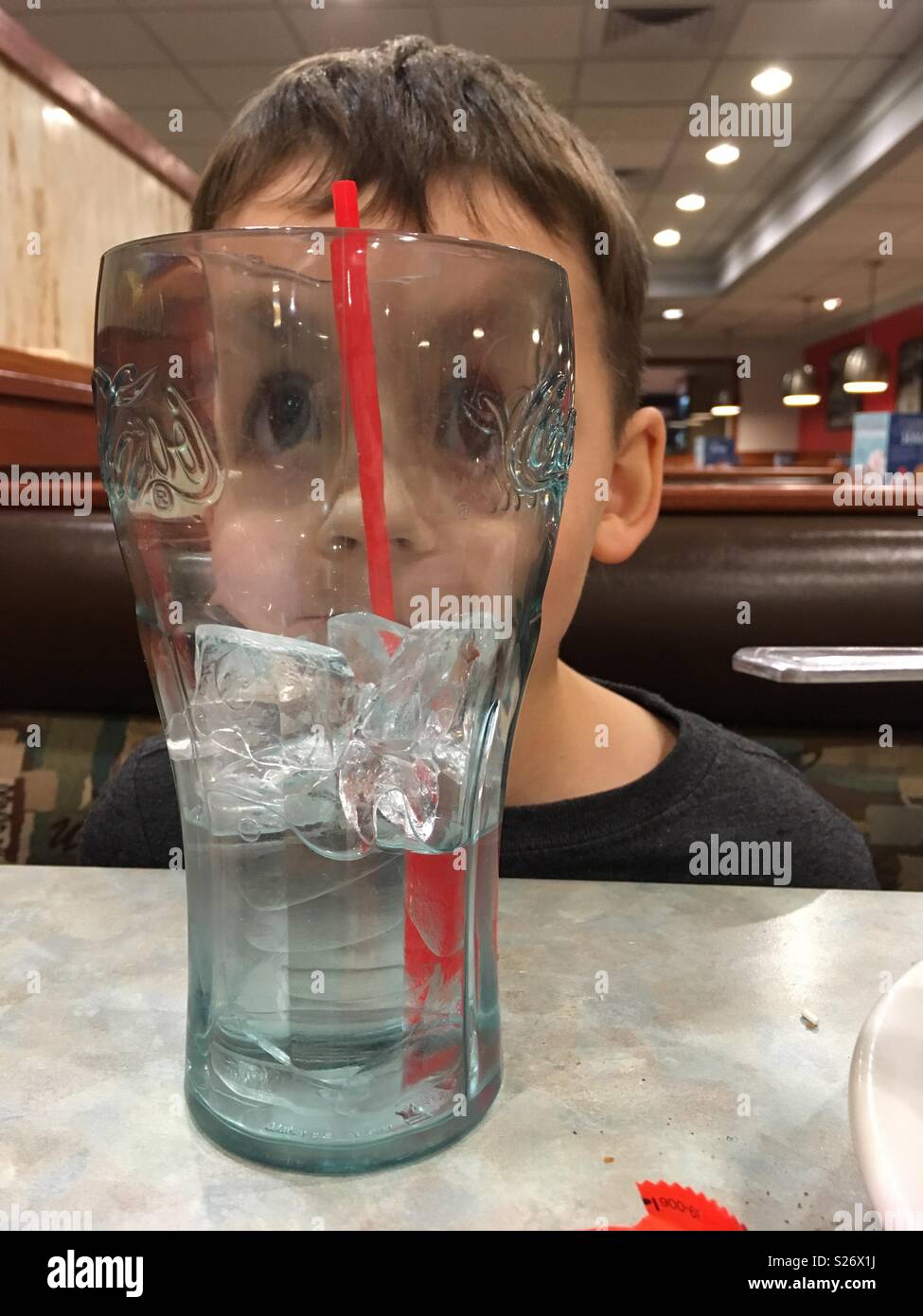 Child’s face distorted by glass Stock Photo - Alamy