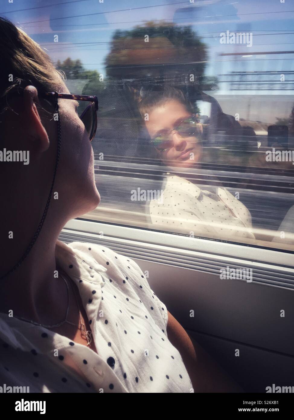 Woman on train Stock Photo - Alamy