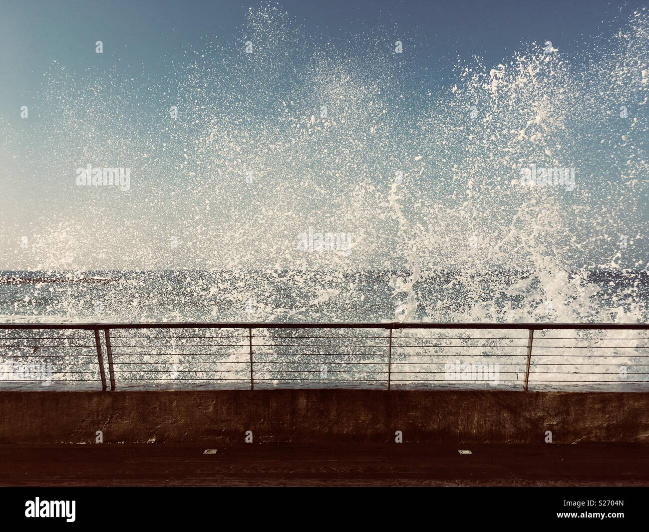 Waves Crashing Against Wall Stock Photos & Waves Crashing Against Wall ...