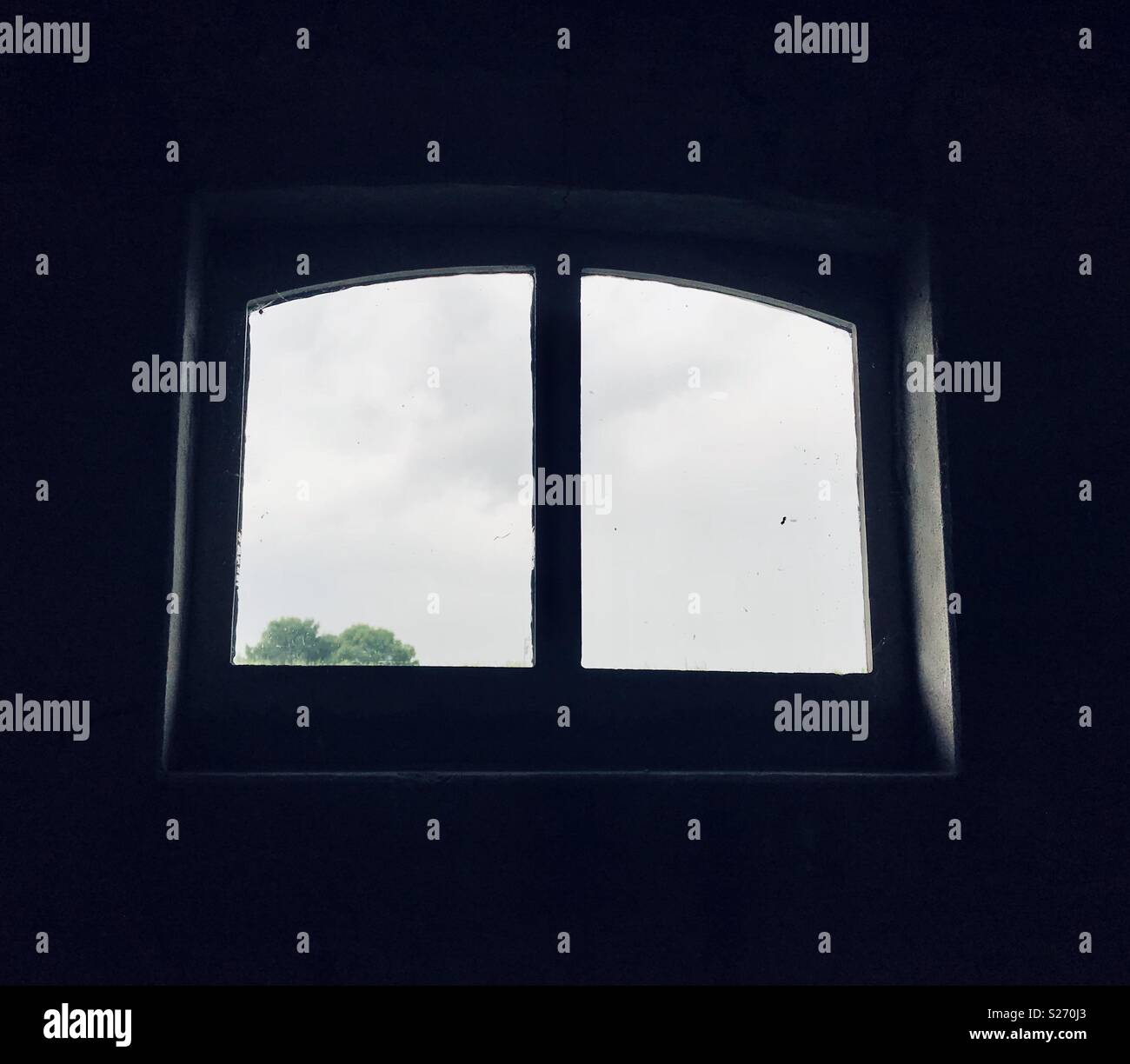 It’s raining and cloudy outside but dark and dry inside the farm Stock ...