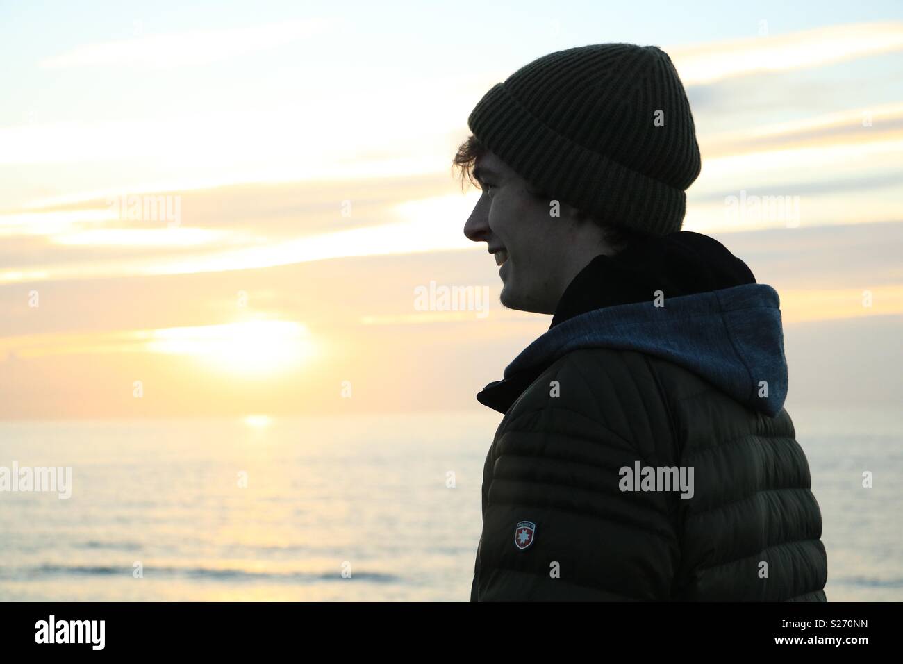 Boy at beach sunset hi-res stock photography and images - Alamy