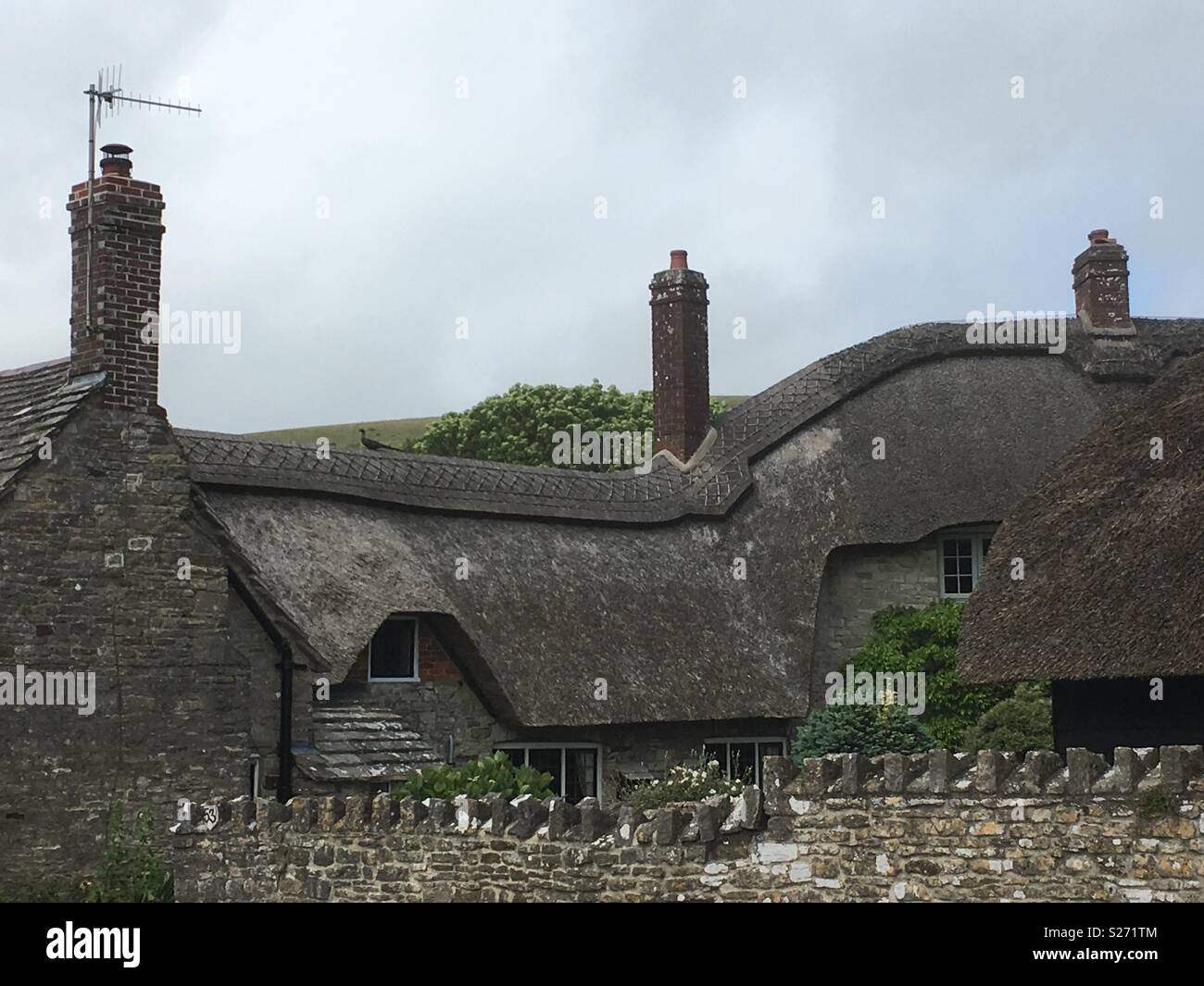 Interesting thatched cottage Dorset Stock Photo - Alamy