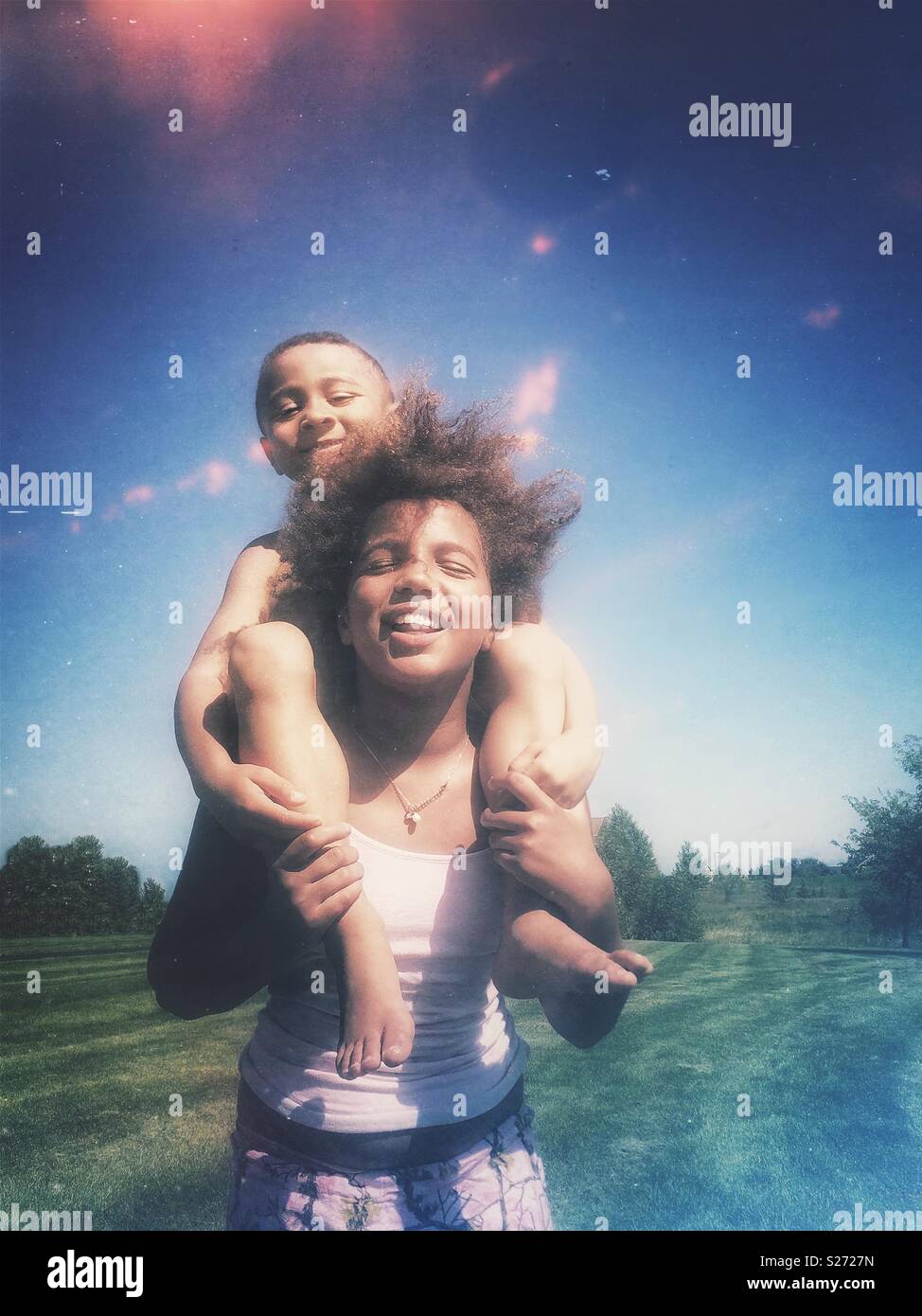 Two kids playing together Stock Photo - Alamy