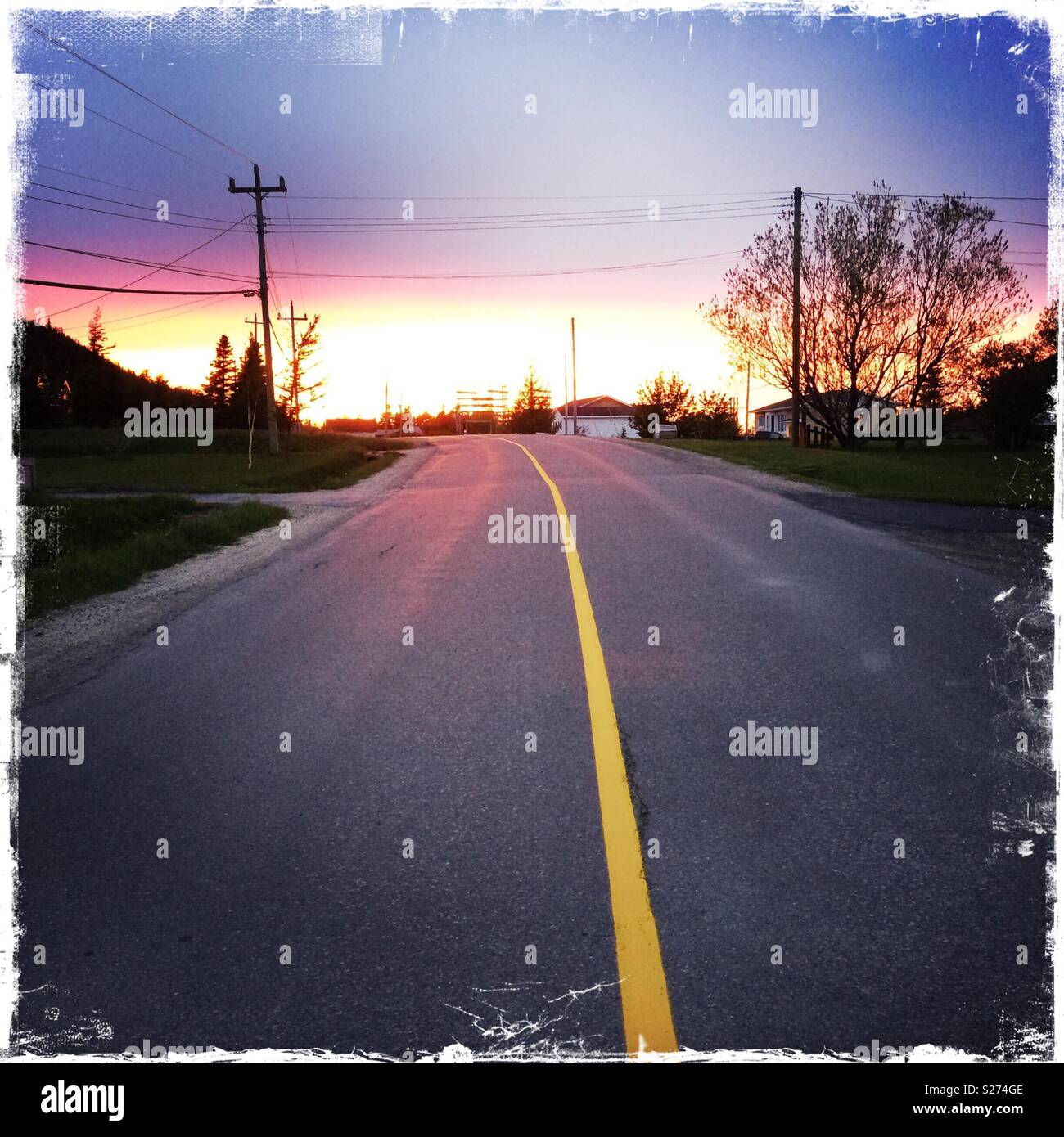 Road at sunset Stock Photo - Alamy