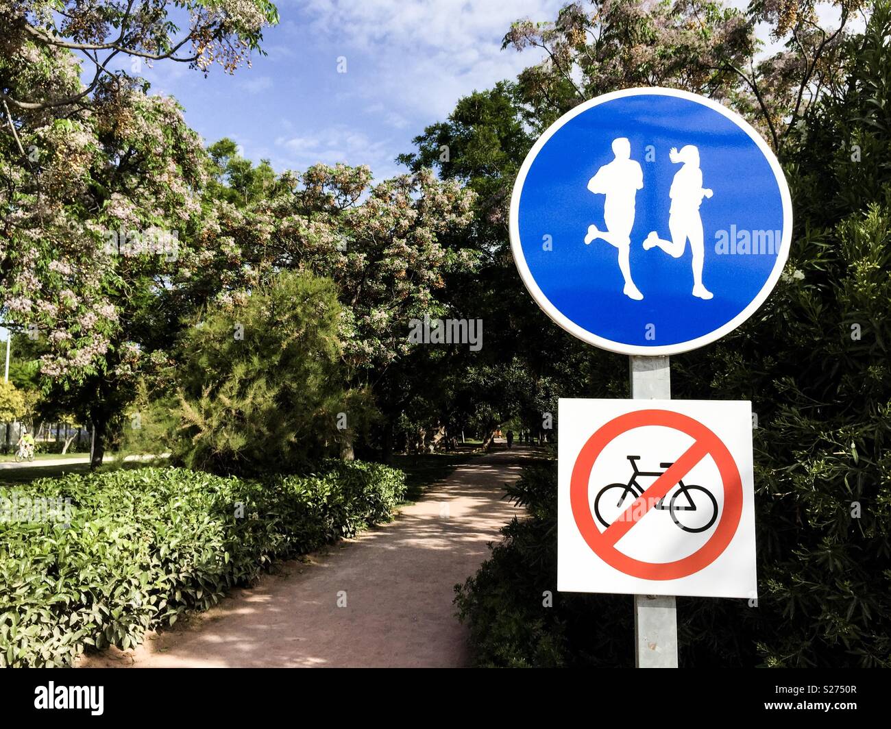 Signs for running and not allowed the bikes Stock Photo - Alamy