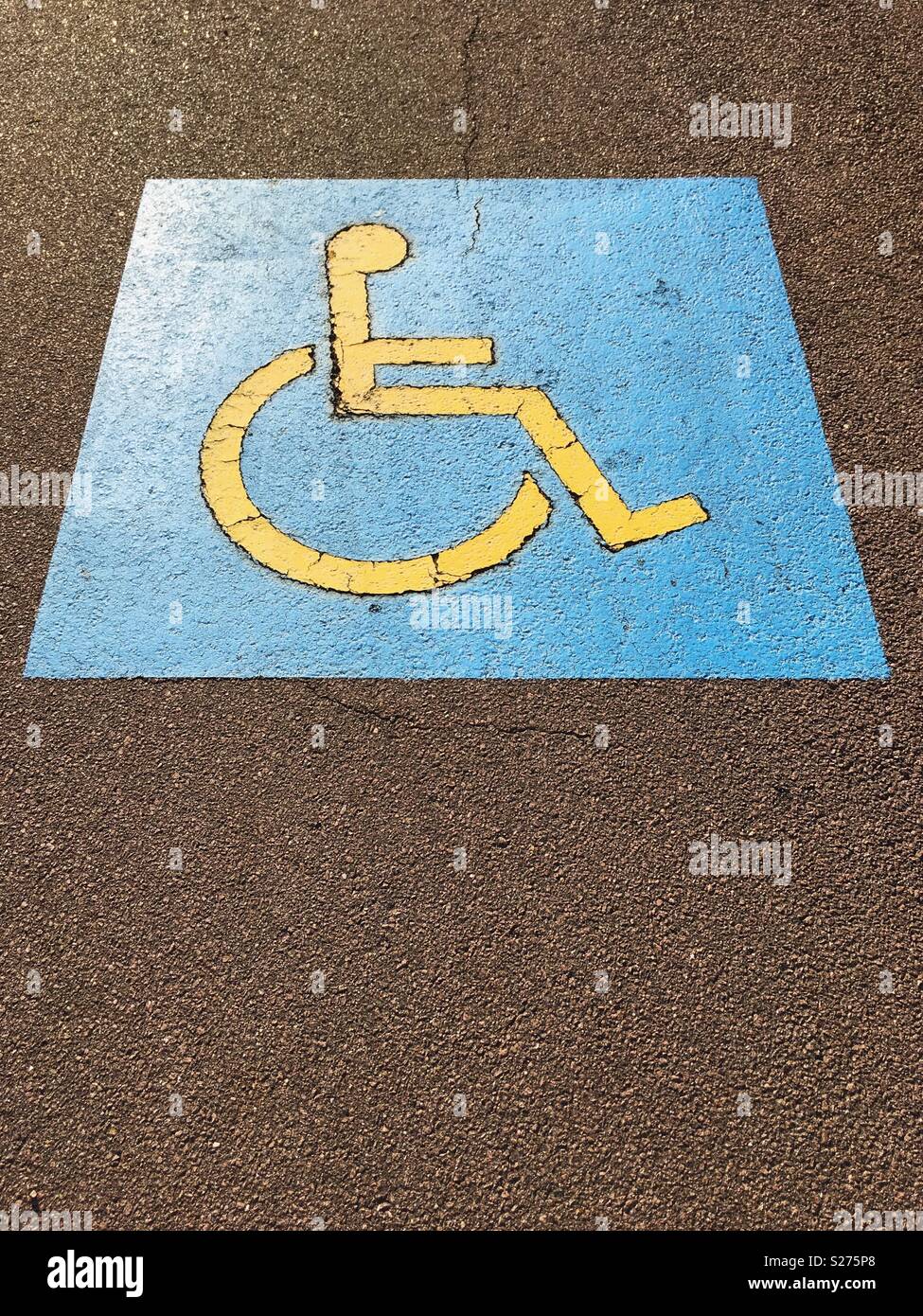 Disabled parking space sign painted on the ground Stock Photo - Alamy