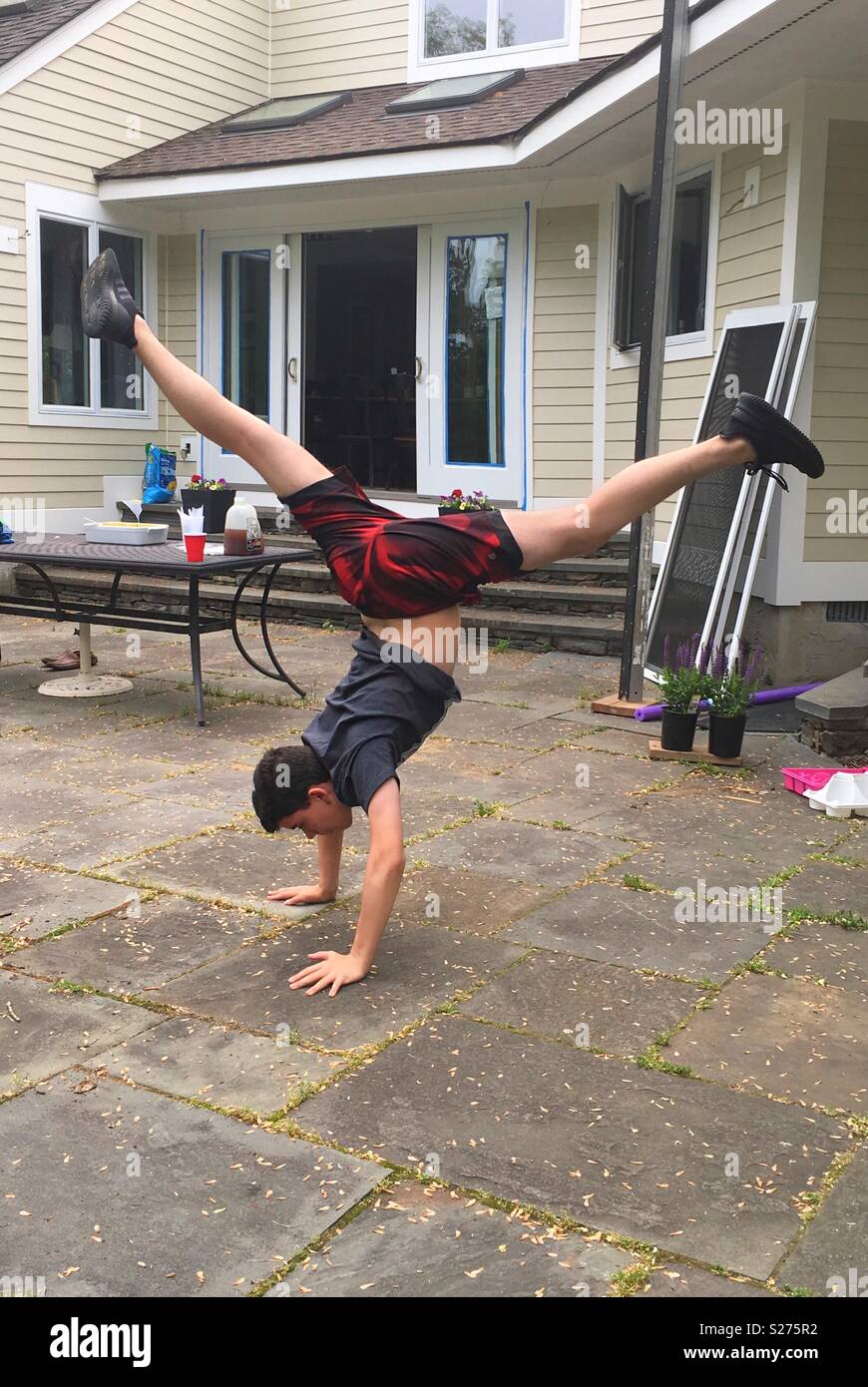 Boy doing a handstand hi-res stock photography and images - Alamy