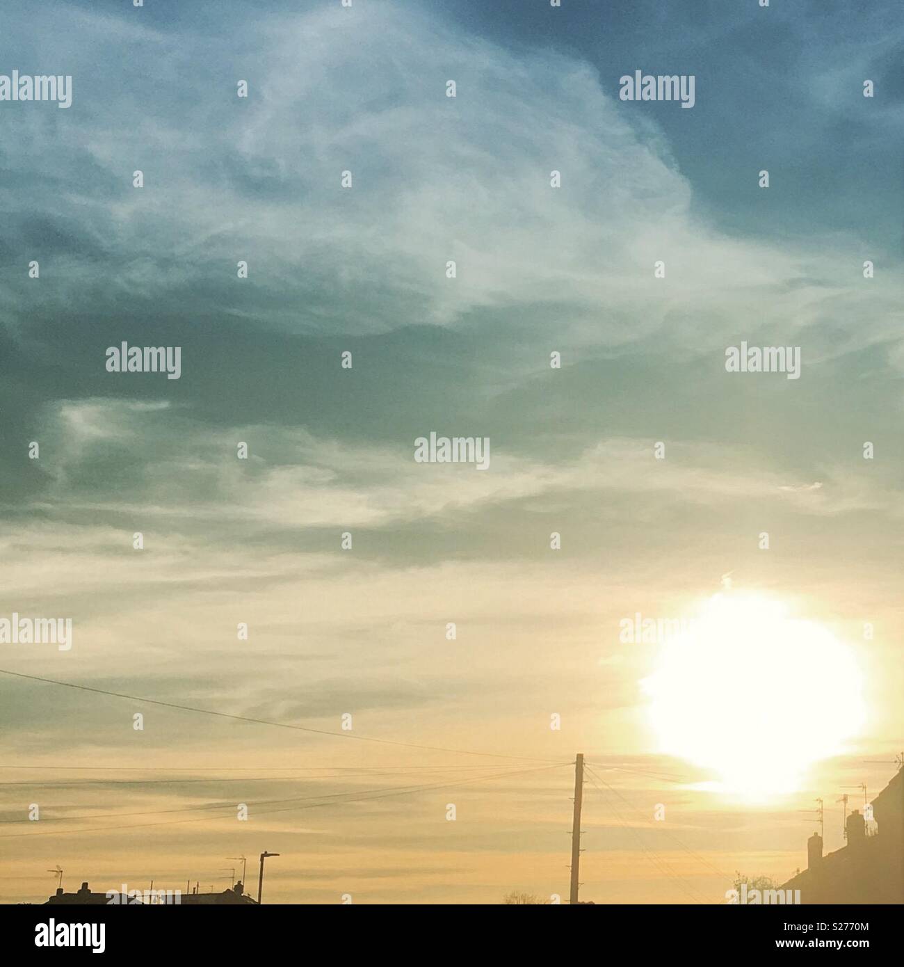 Melting sunset over rooftops Stock Photo - Alamy