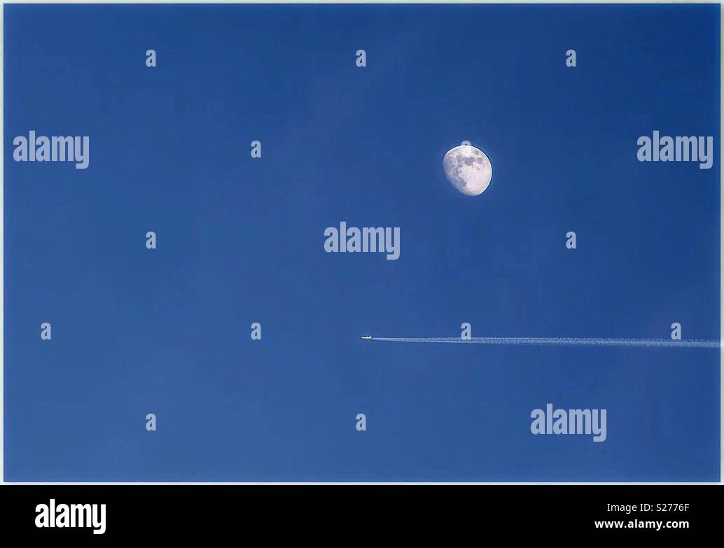 Moon, plane and blue sky Stock Photo - Alamy