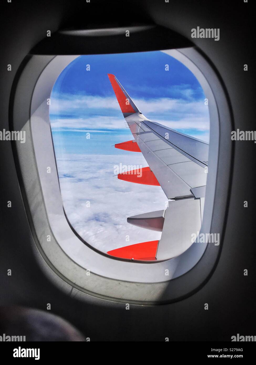 A view through the window of an EasyJet Airbus aircraft, somewhere over ...