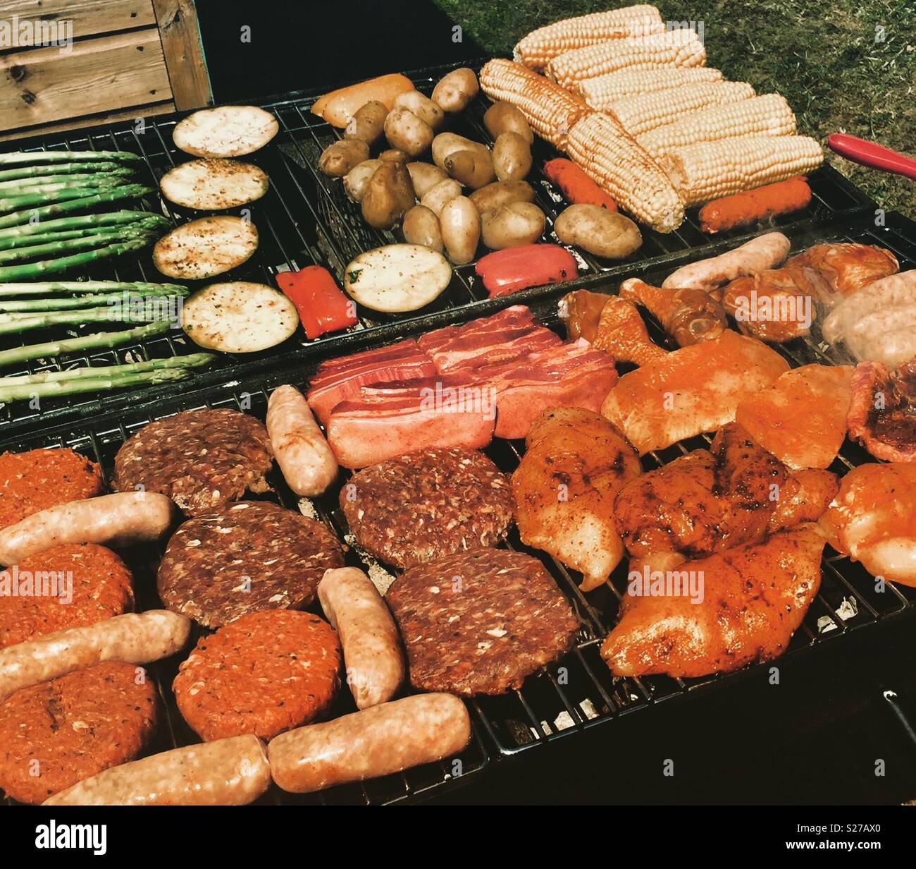 Barbecue packed with meat and veggies Stock Photo - Alamy