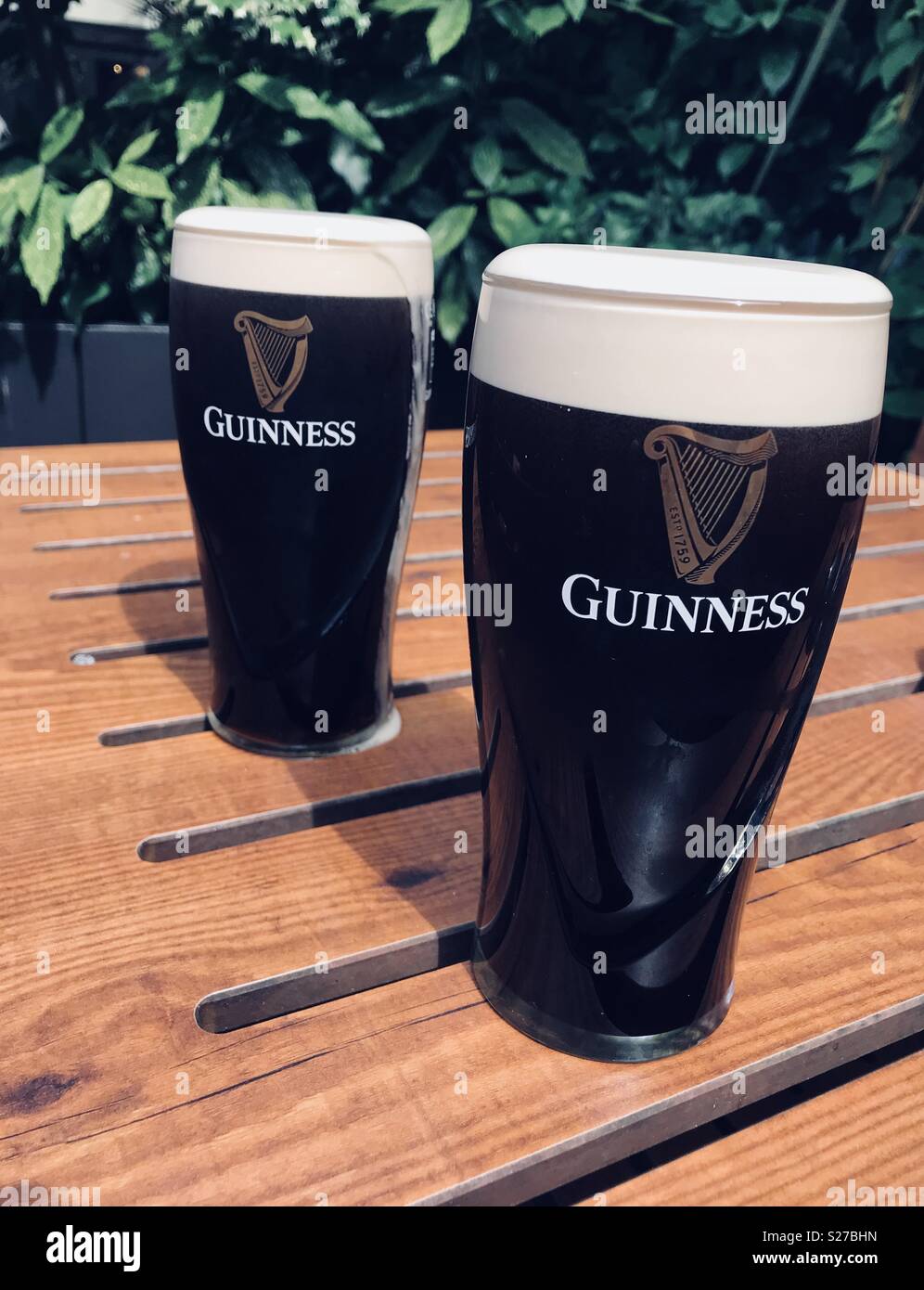 Time for a pint with a friend and you can’t beat a Guinness Stock Photo ...