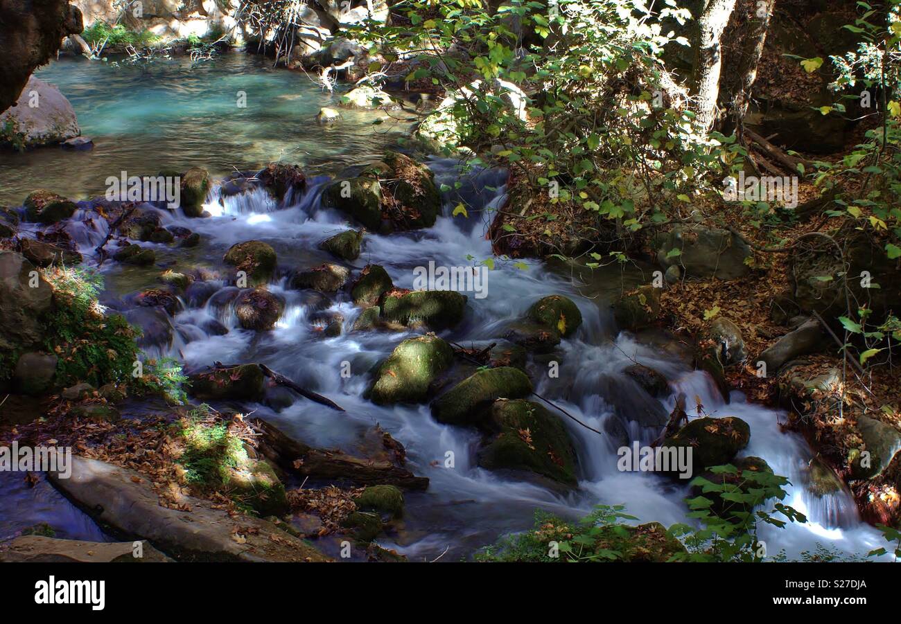 Peaceful stream flowing in a conflicted place Stock Photo - Alamy