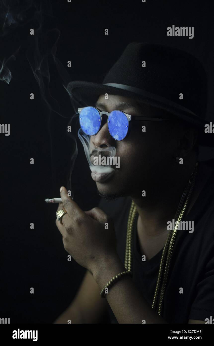 Blowing smoke hi-res stock photography and images - Alamy