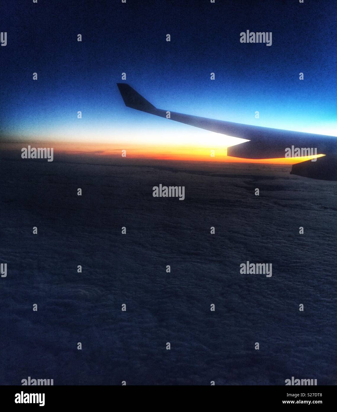 Flying home over the Atlantic Ocean above the clouds Stock Photo - Alamy