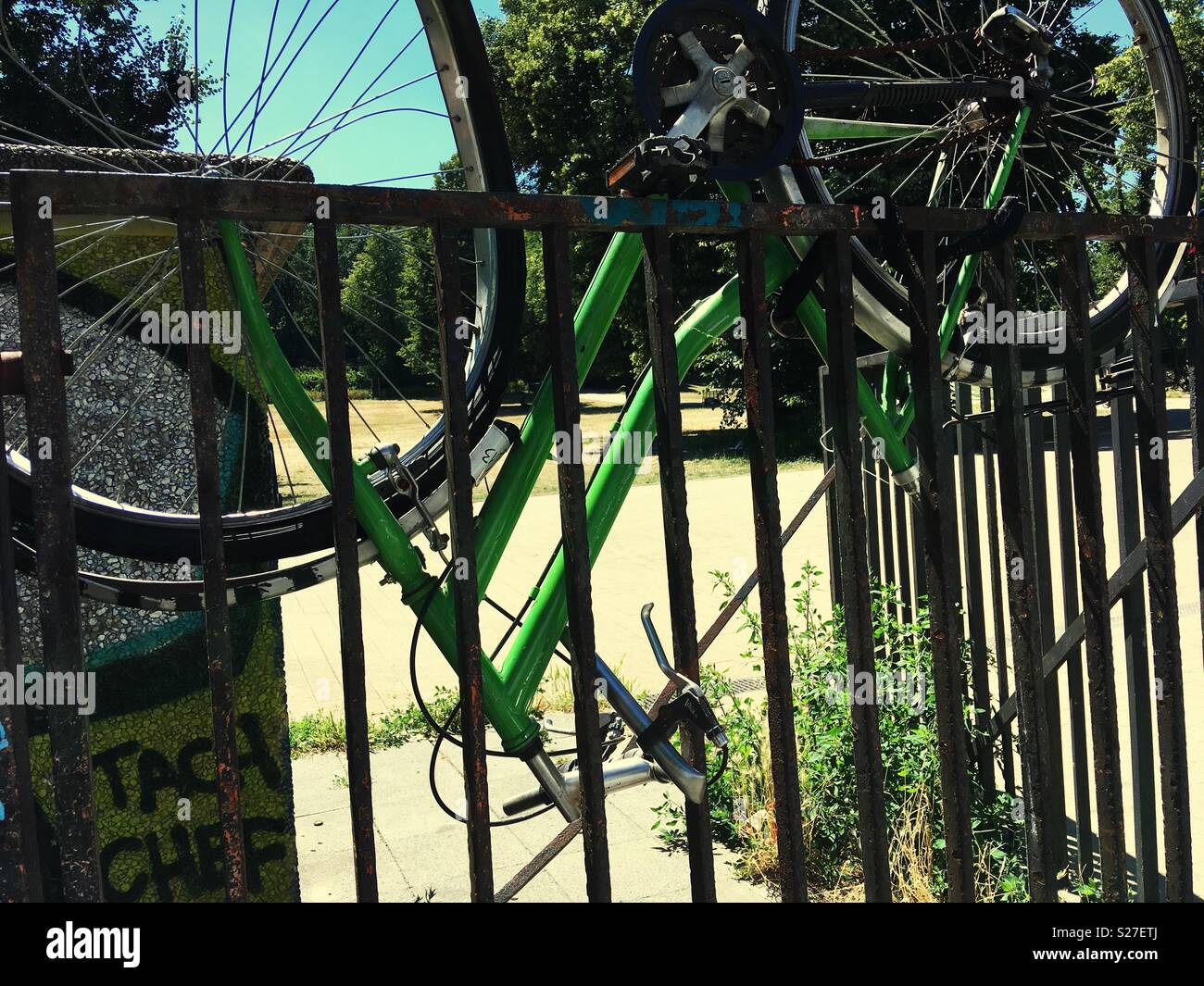 Bike hanging on a fence Stock Photo - Alamy
