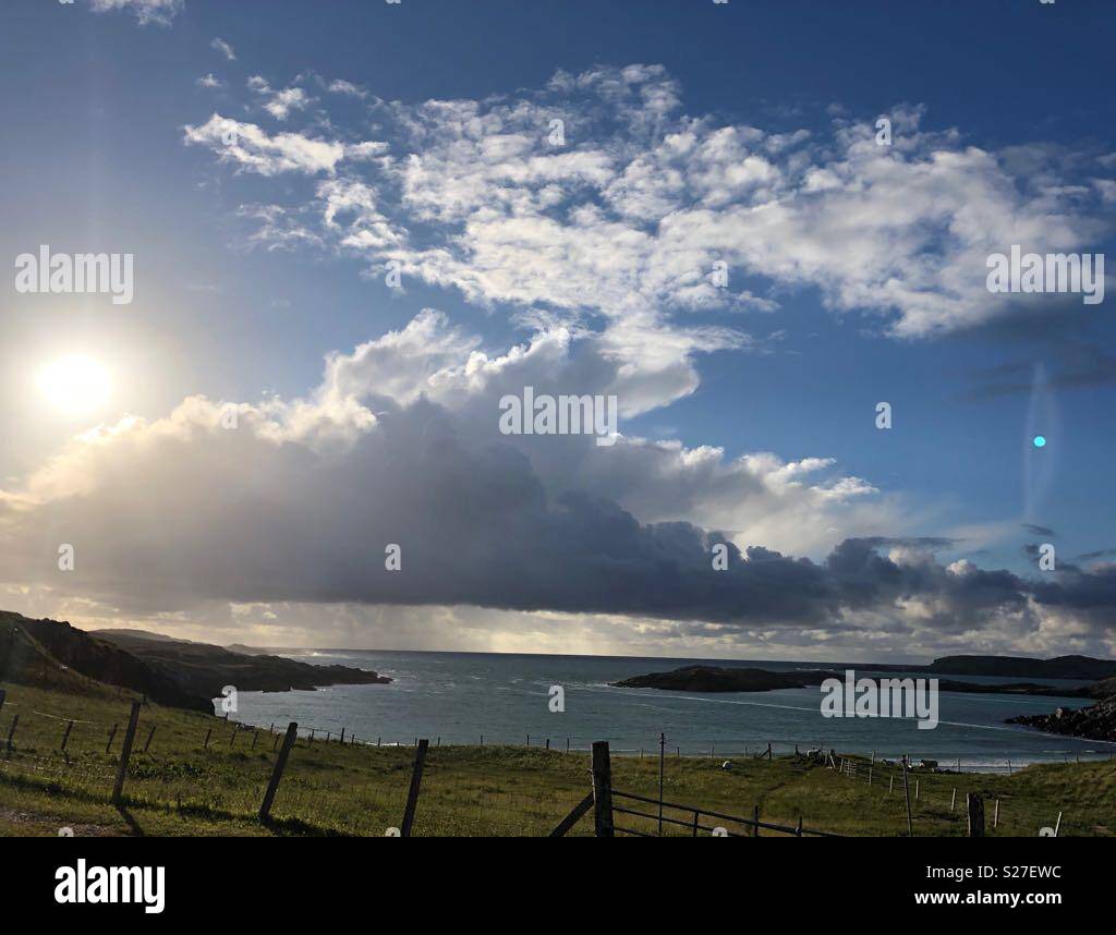 Clouds over Carnish Beach in June Stock Photo - Alamy