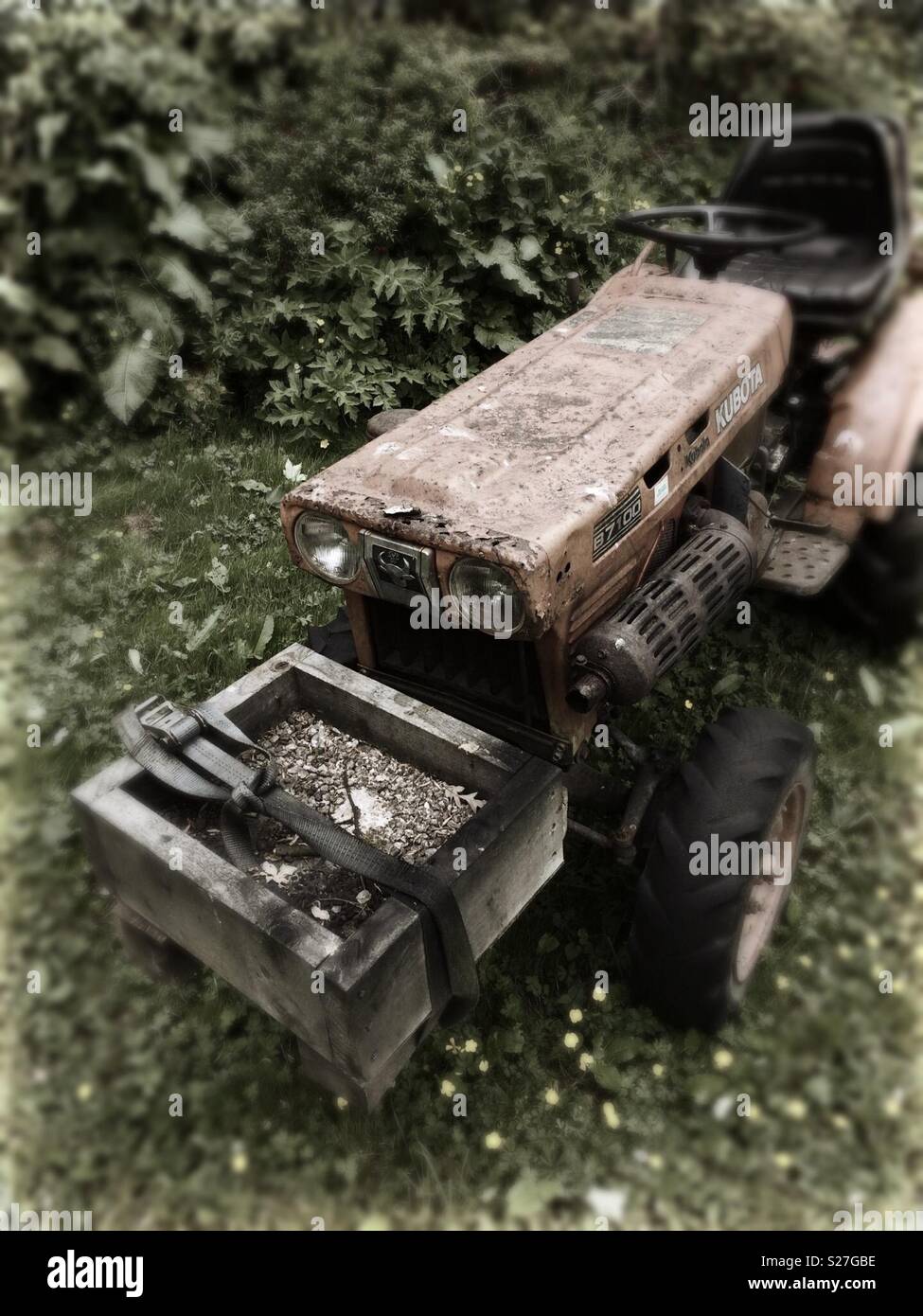 Old mini tractor Stock Photo - Alamy