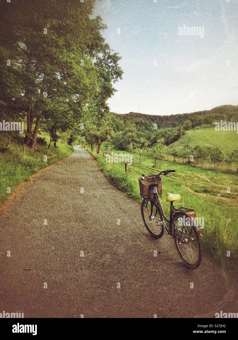 Retro bike on a rural road Stock Photo - Alamy