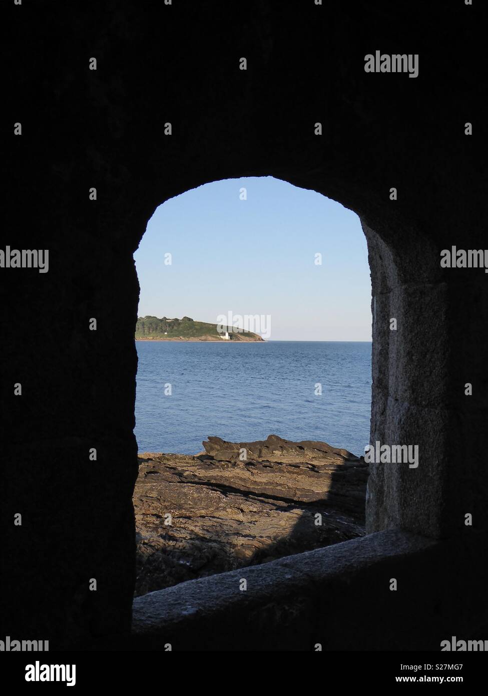 View of Lighthouse through Castle Window Stock Photo - Alamy