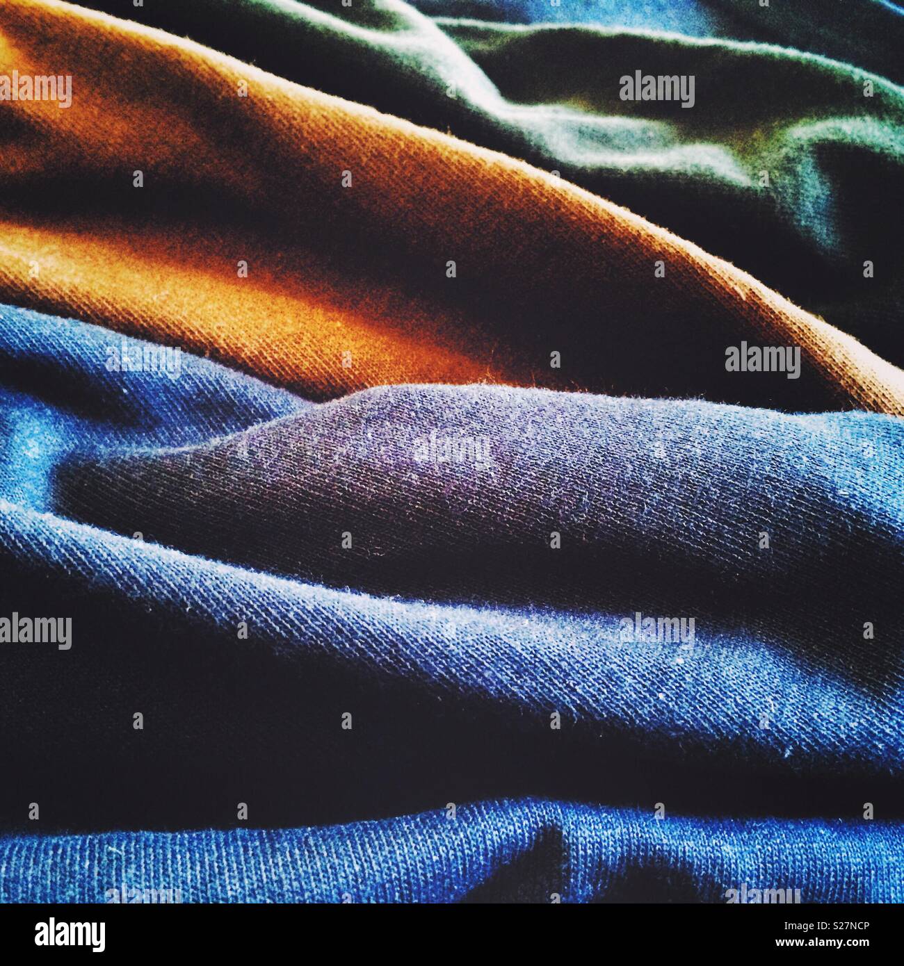 light and shadow create waves of colorful fabric Stock Photo - Alamy