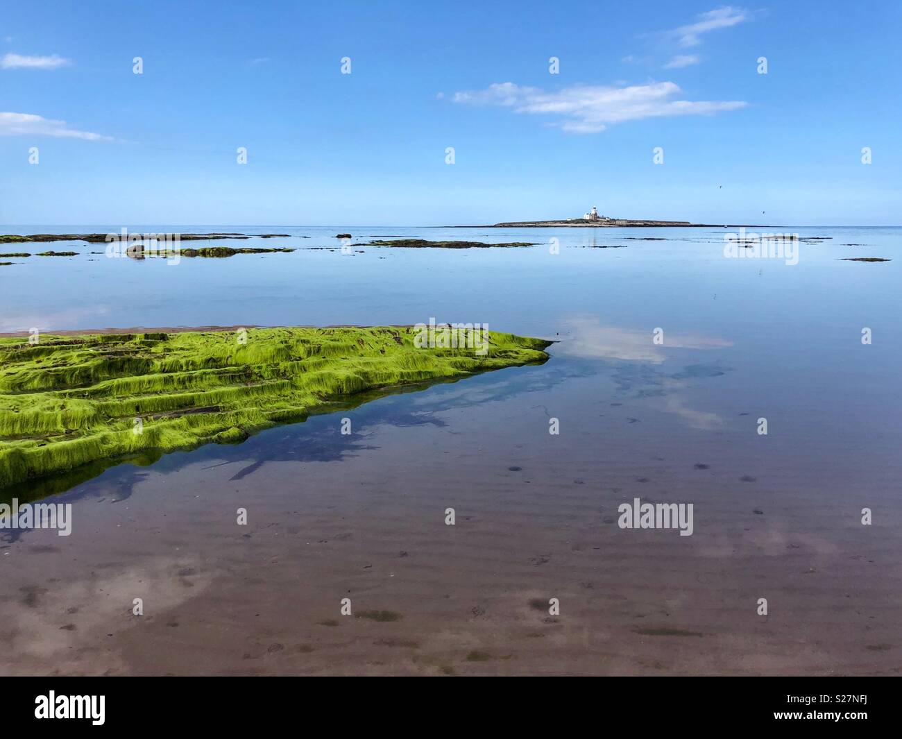 Sky reflecting on the water near Coquet Island lighthouse Stock Photo ...