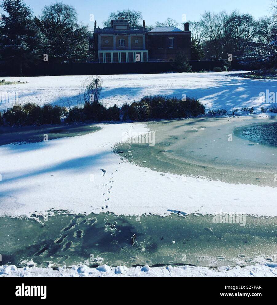 Snow scene across a frozen lake Stock Photo - Alamy