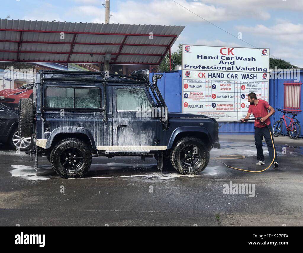 Land Rover clean up Stock Photo - Alamy