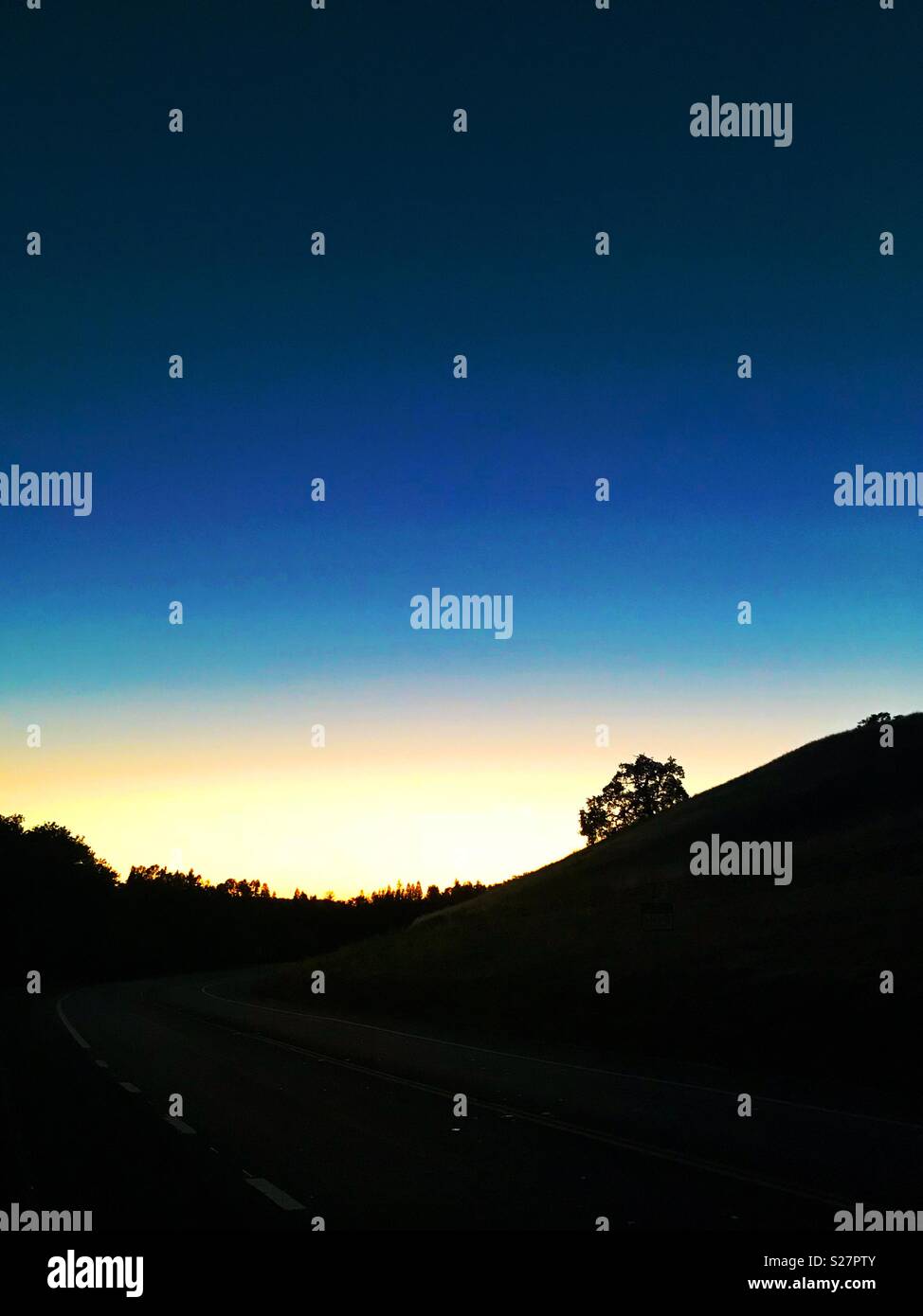 Twilight over foothills Stock Photo - Alamy