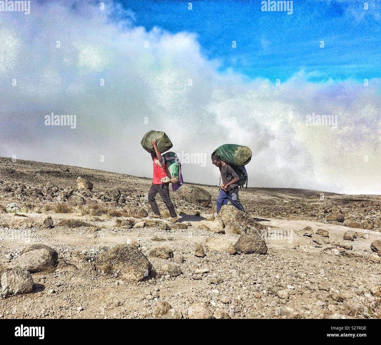 Porters carrying heavy bags hi-res stock photography and images - Alamy