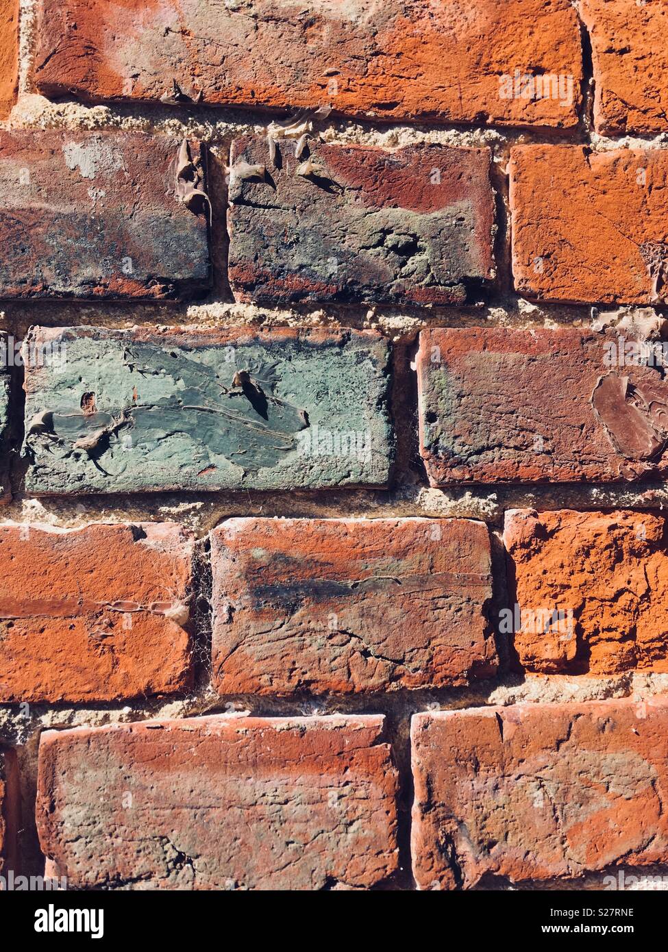 Victorian brickwork indicating its age with marks, damage and added ...