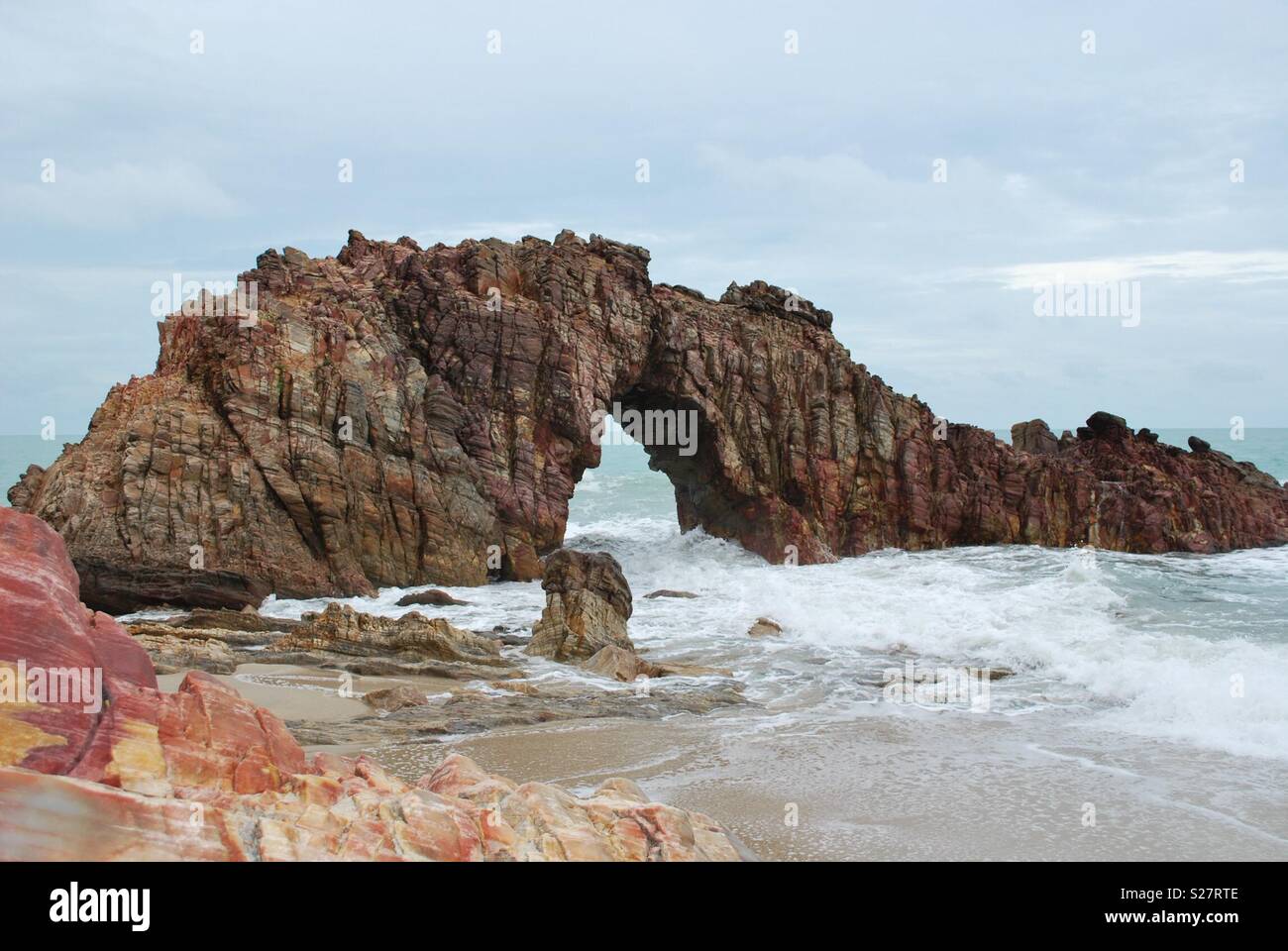 Iconic rock formation, Pedra Furada, Jericoacora, Brazil Stock Photo ...