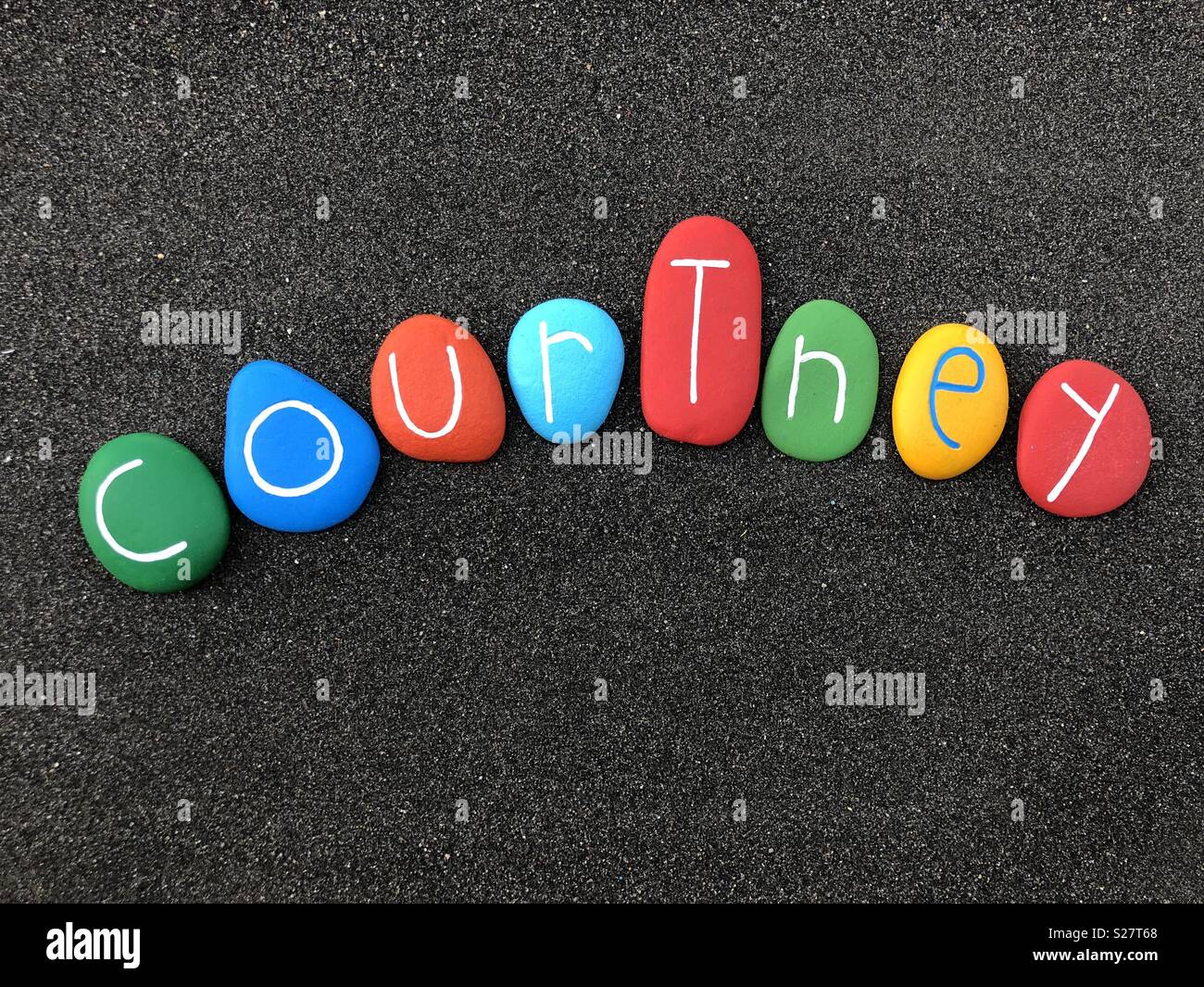 Courtney, feminine given name with multi colored painted stone letters ...