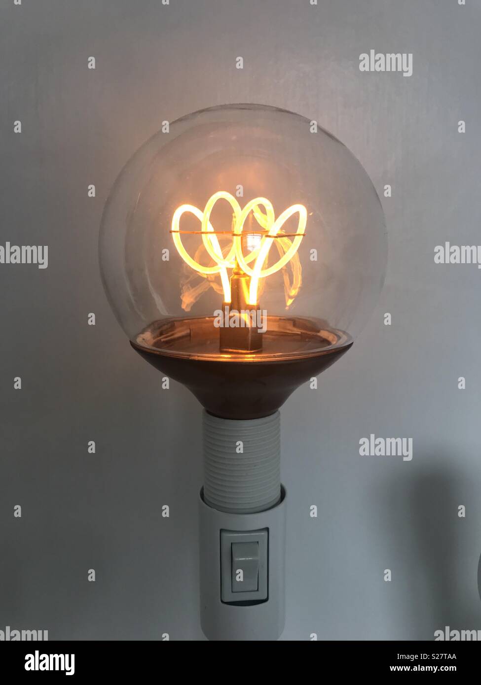 Light bulb with light coil Stock Photo - Alamy