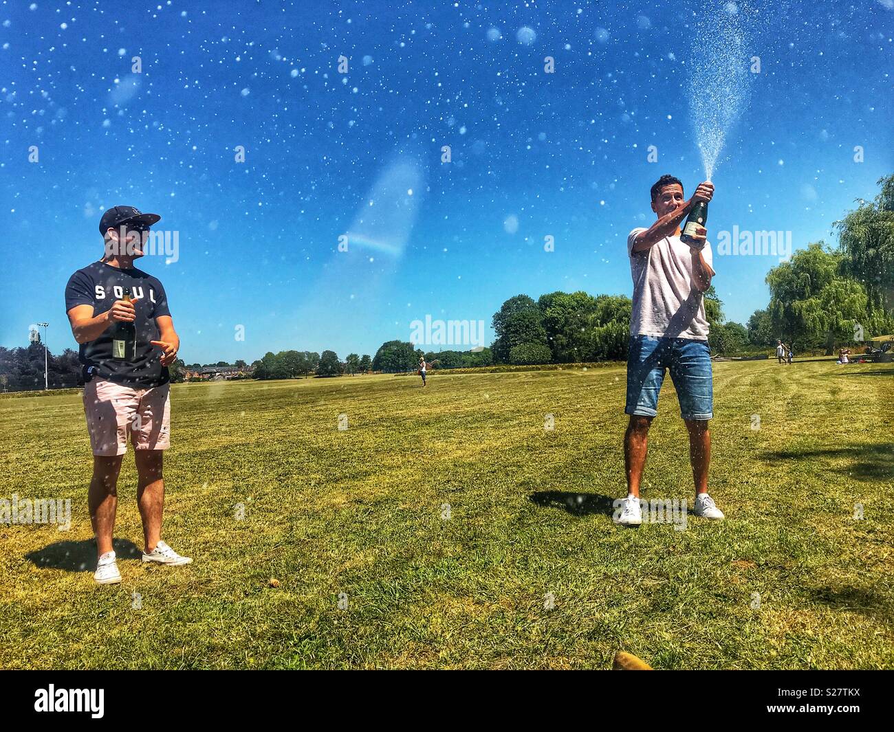 Celebrate in style with a champagne spray! Stock Photo - Alamy