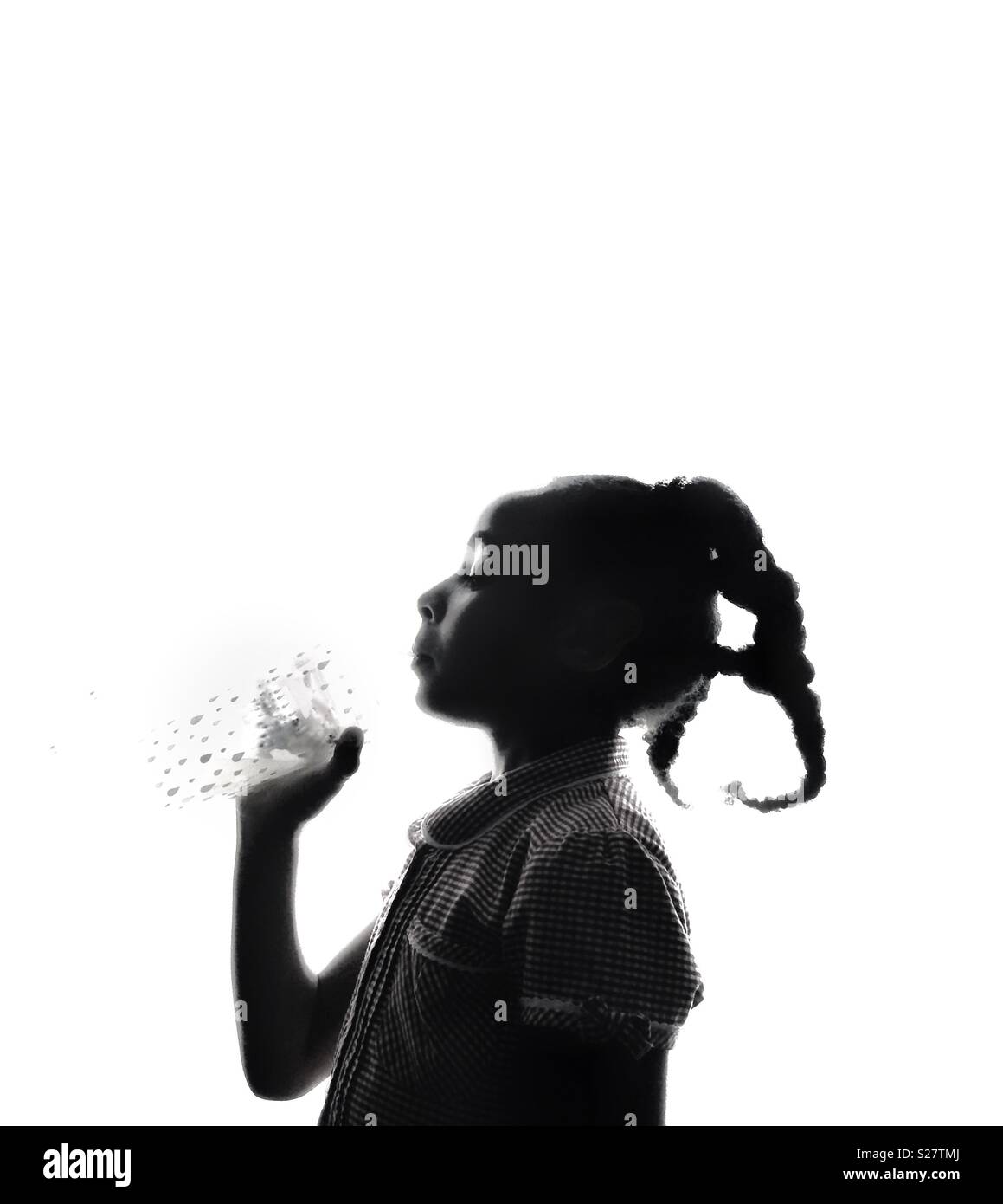 A young girl drinking from a beaker Stock Photo - Alamy