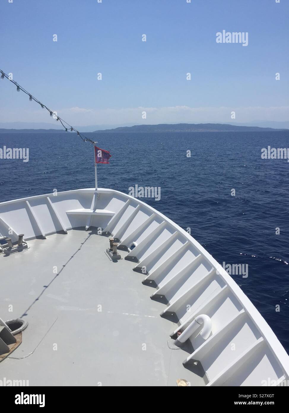 Boat flying the Hydra flag on its way to Spetses, Greece Stock Photo ...