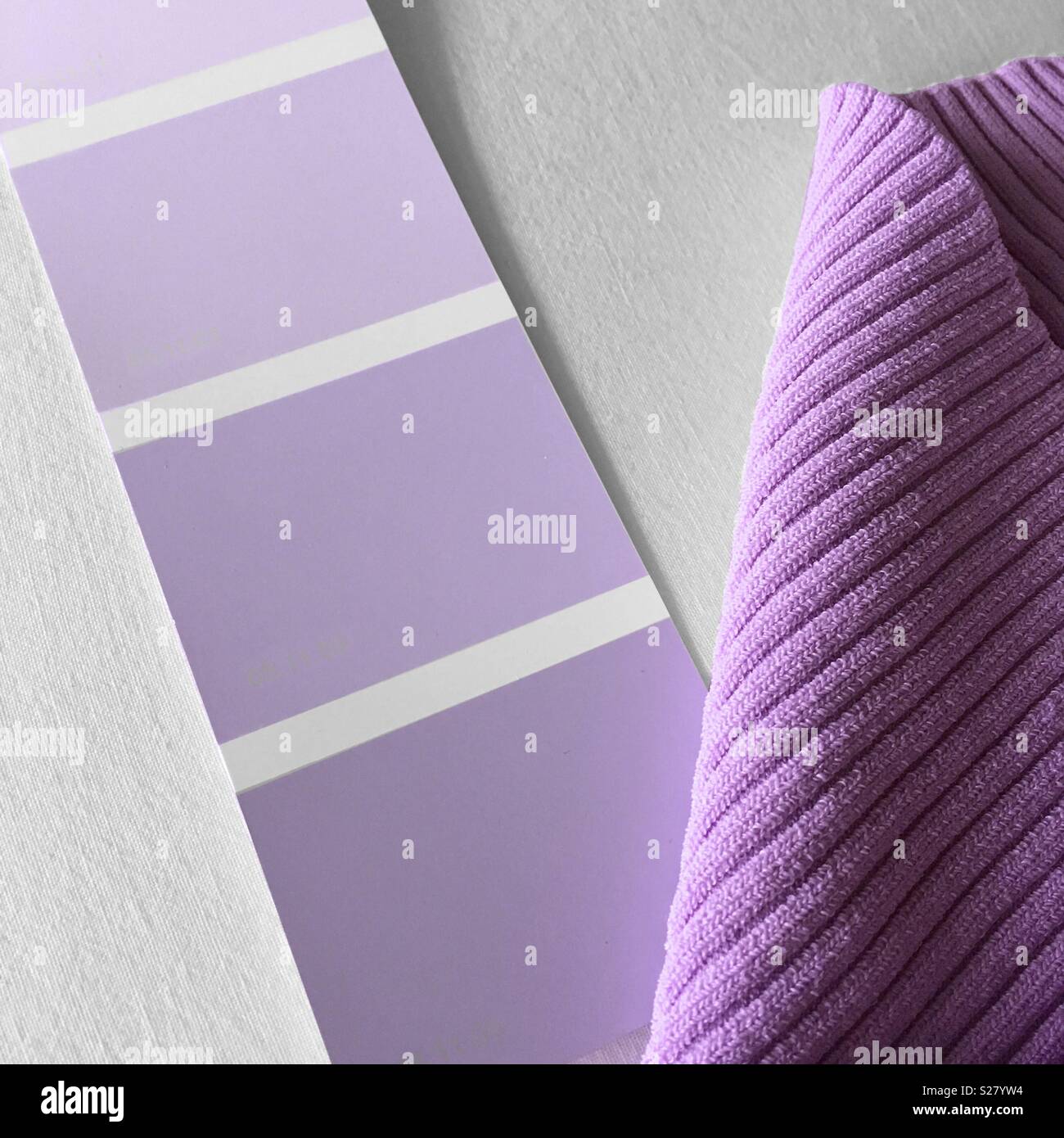 Composition of lilac fabric and colour swatches Stock Photo - Alamy