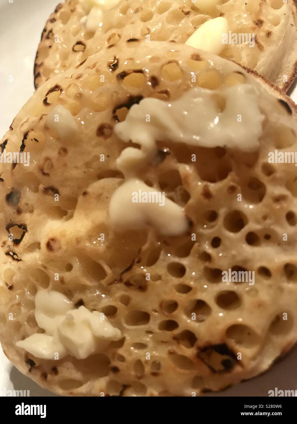 Buttered crumpets hi-res stock photography and images - Alamy