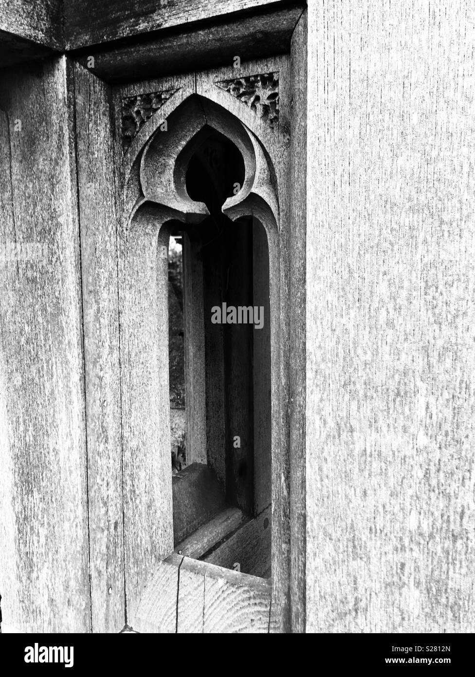 Wooden church window shaped carving in mono Stock Photo - Alamy