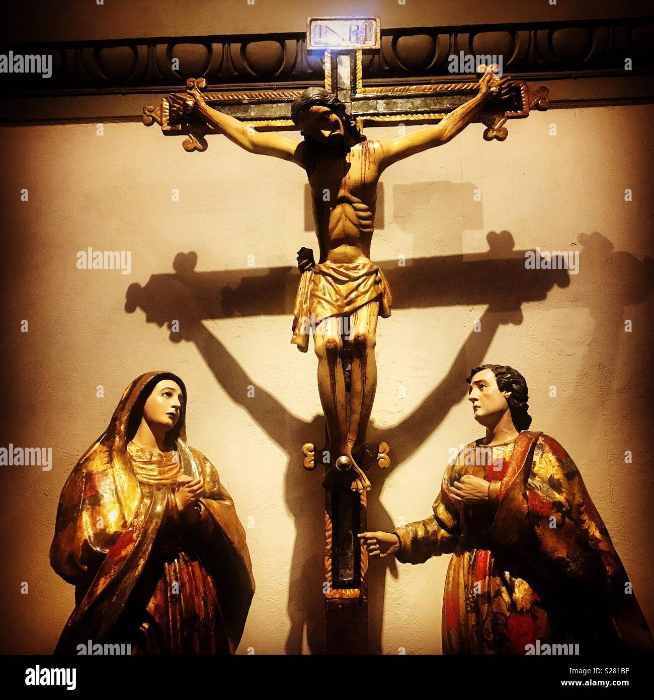 An image of Jesus Christ crucified, Saint John and Saint Mary Magdalene in the museum of the ...