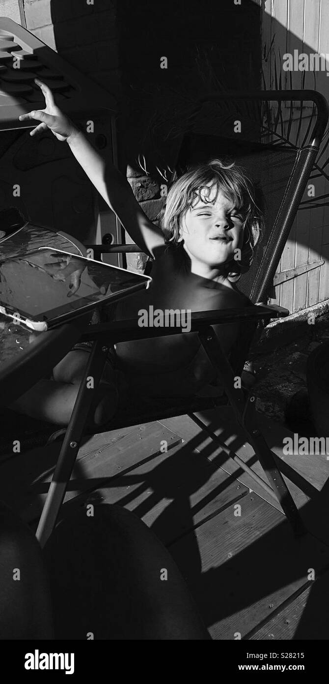 Cool dude kid looking smug Stock Photo - Alamy