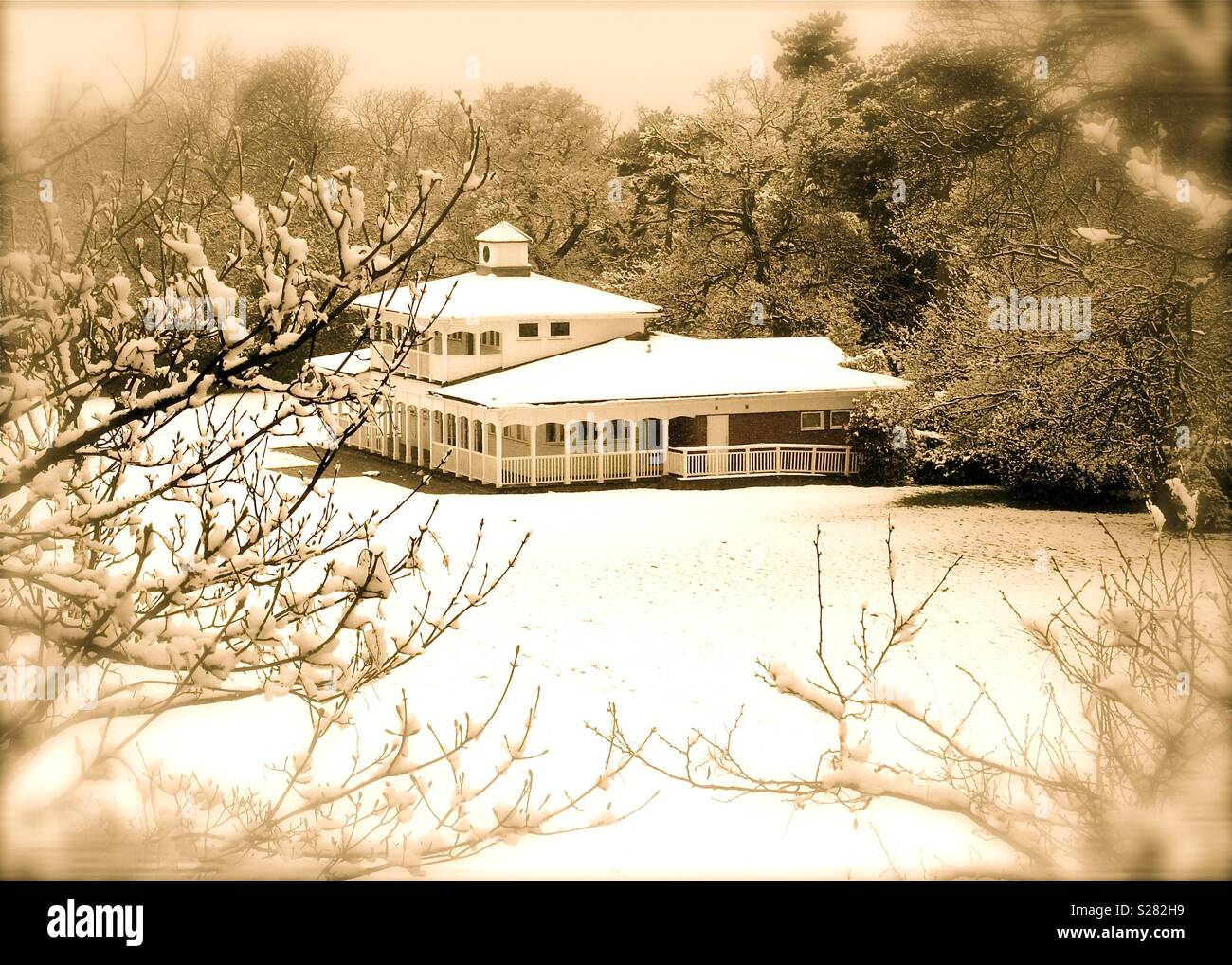 Sepia snow shot of victorian pavilion through trees Stock Photo - Alamy