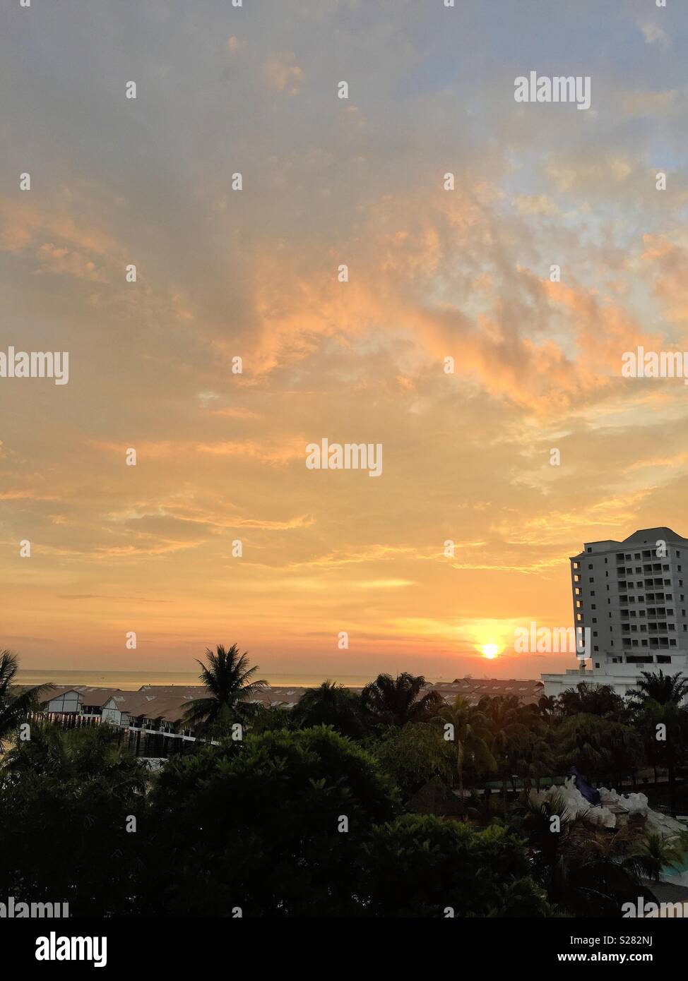 Sunset view over the balcony Stock Photo - Alamy