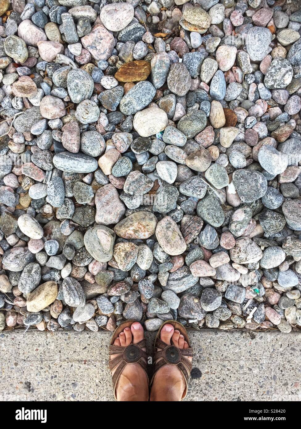 Feet on pebbles hi-res stock photography and images - Alamy