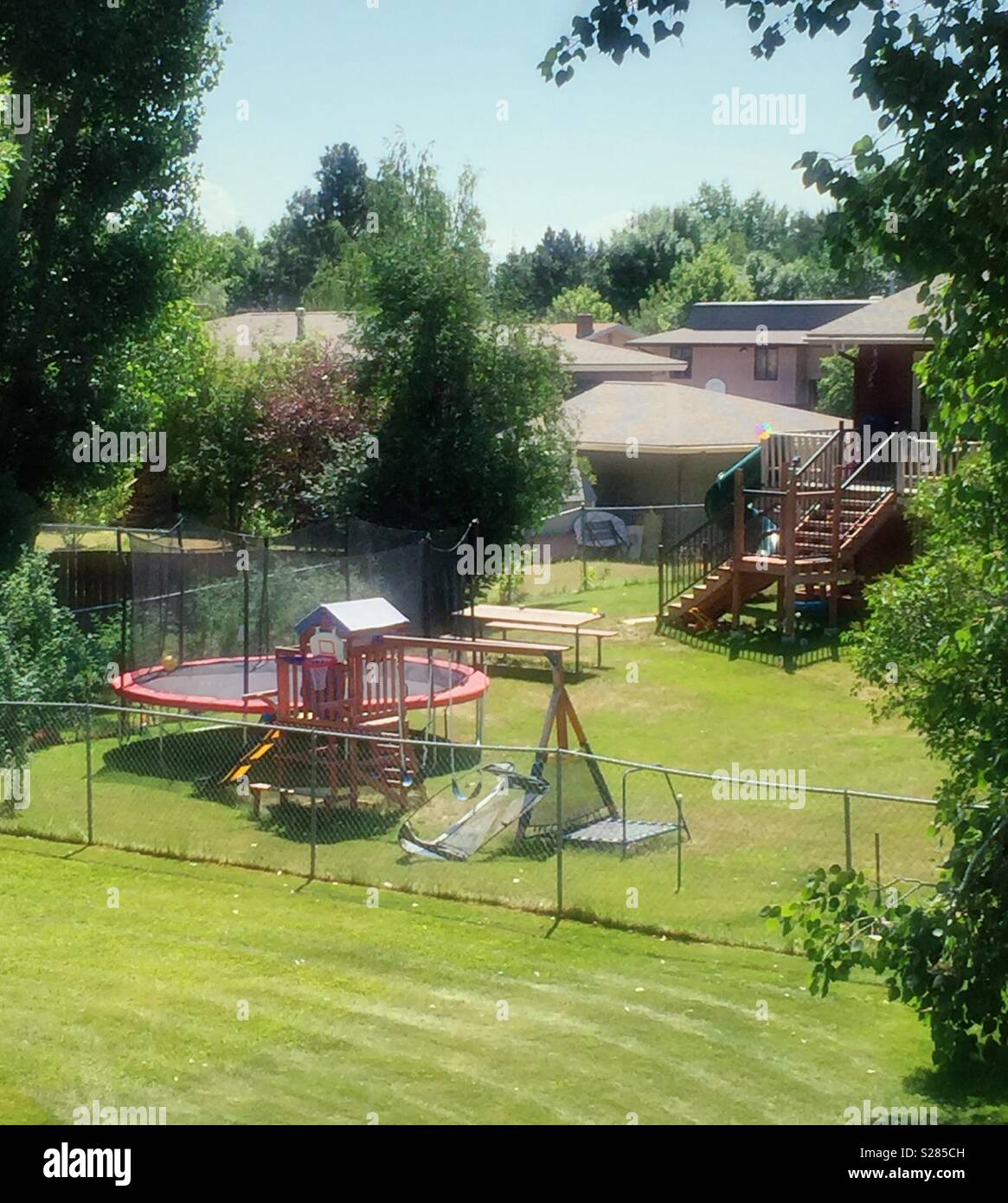 Suburban neighborhood backyards with children’s play sets, USA Stock ...