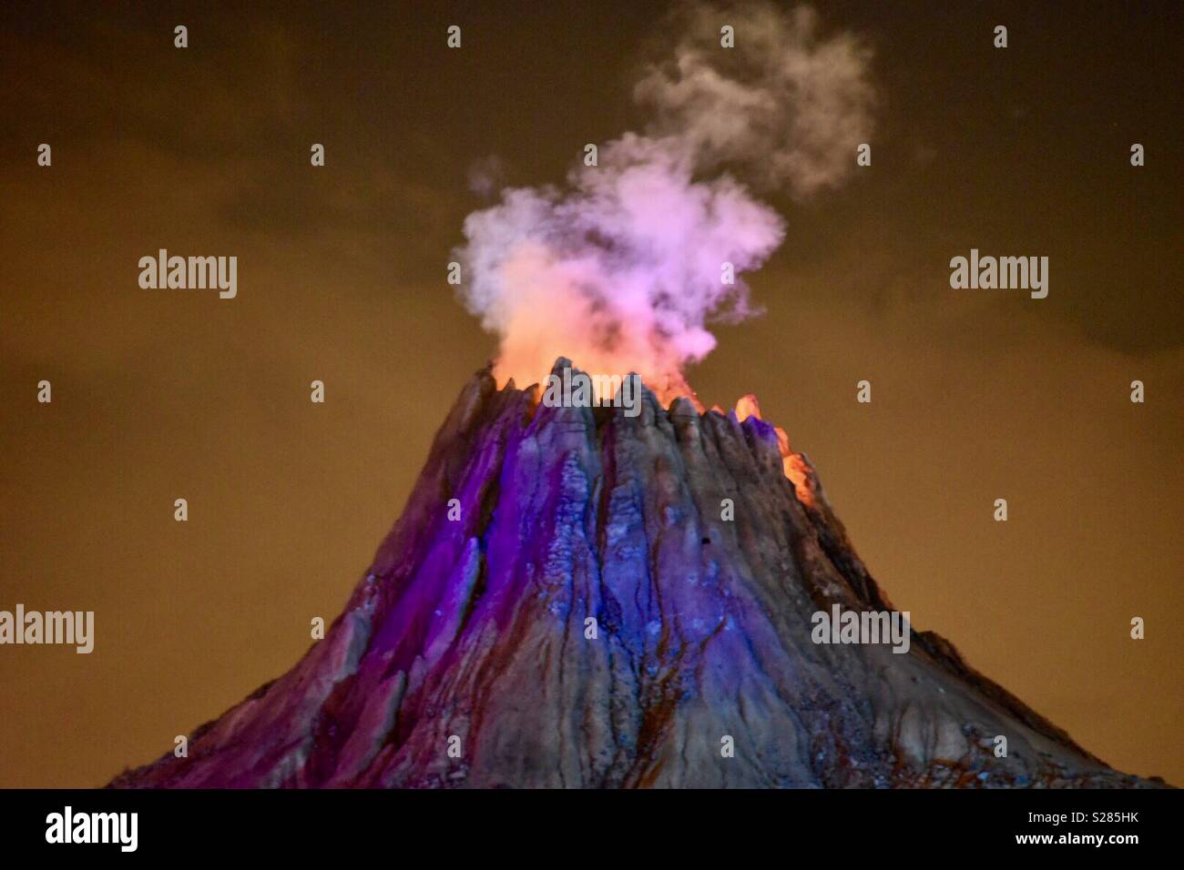 Nighttime smoking volcano Stock Photo - Alamy