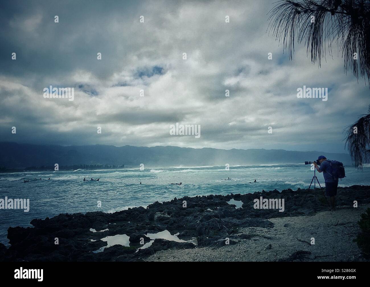 Photographer photographing surfers on the North Shore of Oahu Stock ...